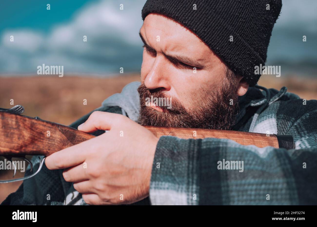 Pulled the trigger of the shotgun. Vintage hunter. Hunter with shotgun ...