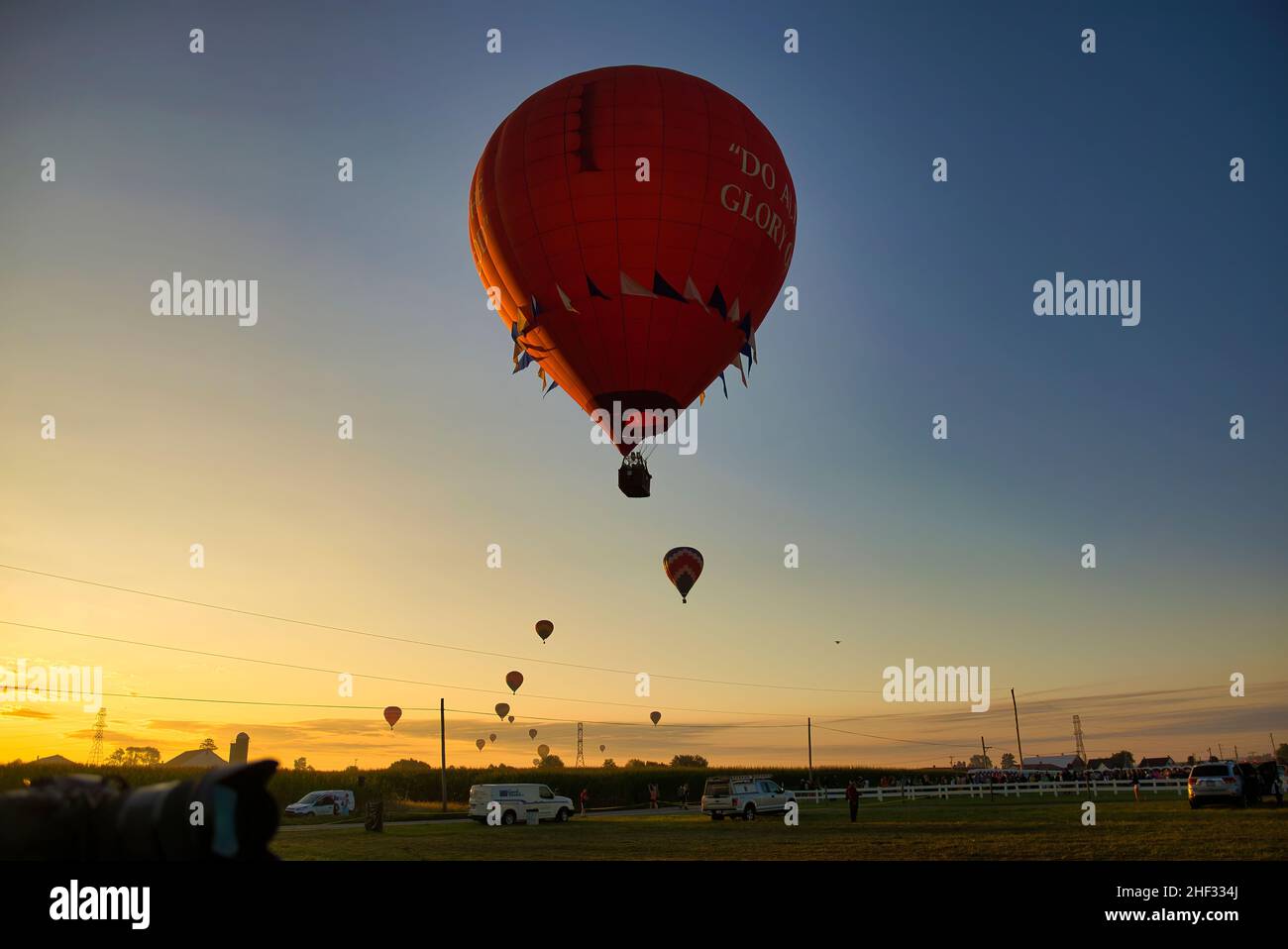 View of Many Hot Air Balloons Getting Ready to Take Off On An Early ...