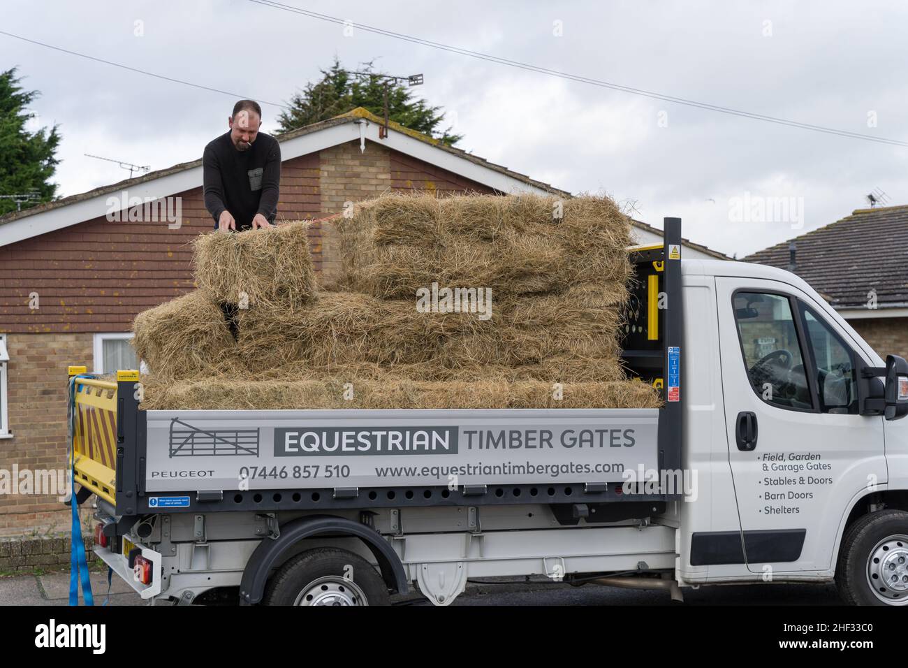 A man unload a truck load of hat stacks from his truck Equestrian Kent ...