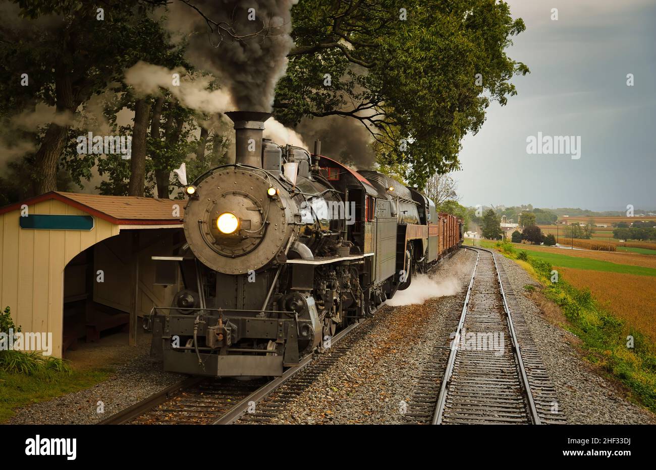 An Antique Restored Steam Freight Train Approaching Head on Blowing ...