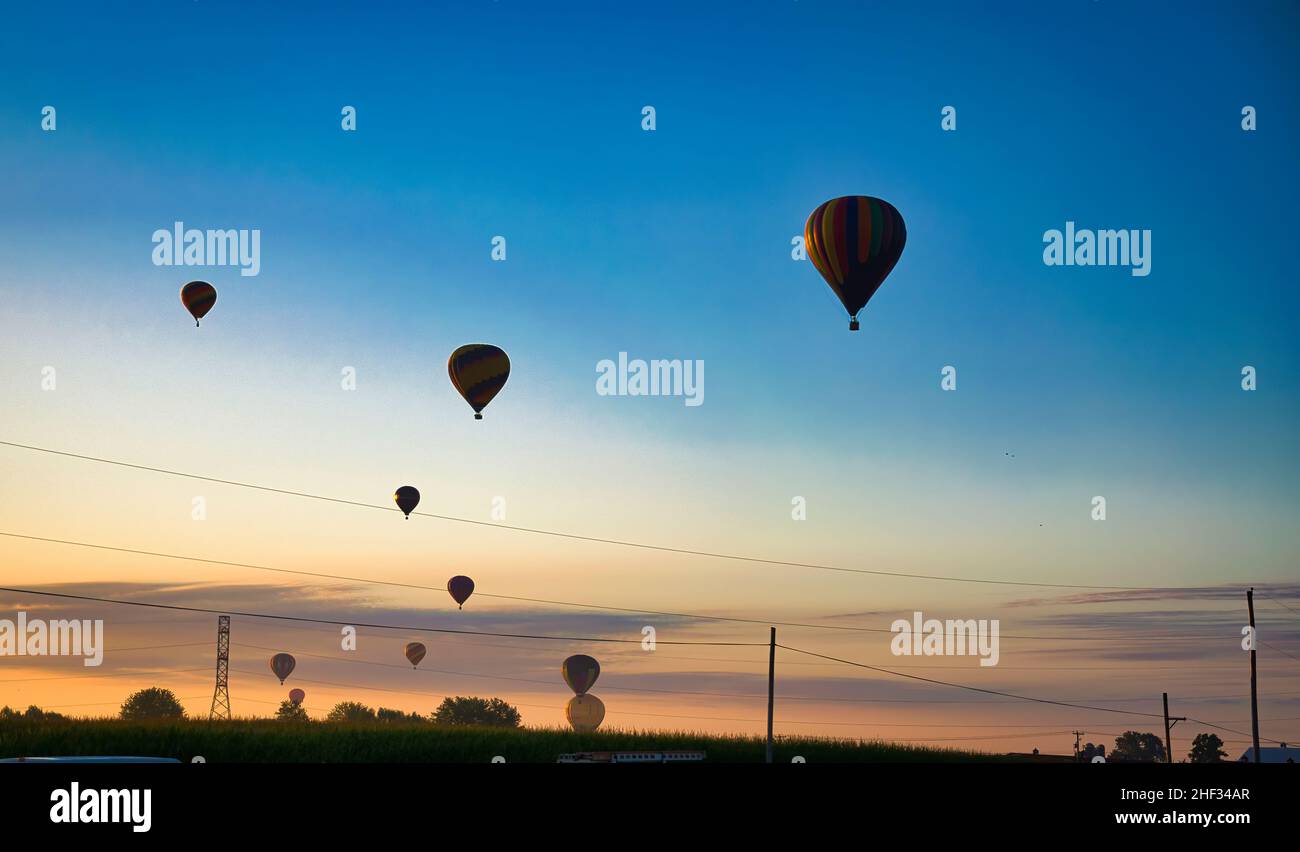 View of Many Hot Air Balloons Getting Ready to Take Off On An Early ...