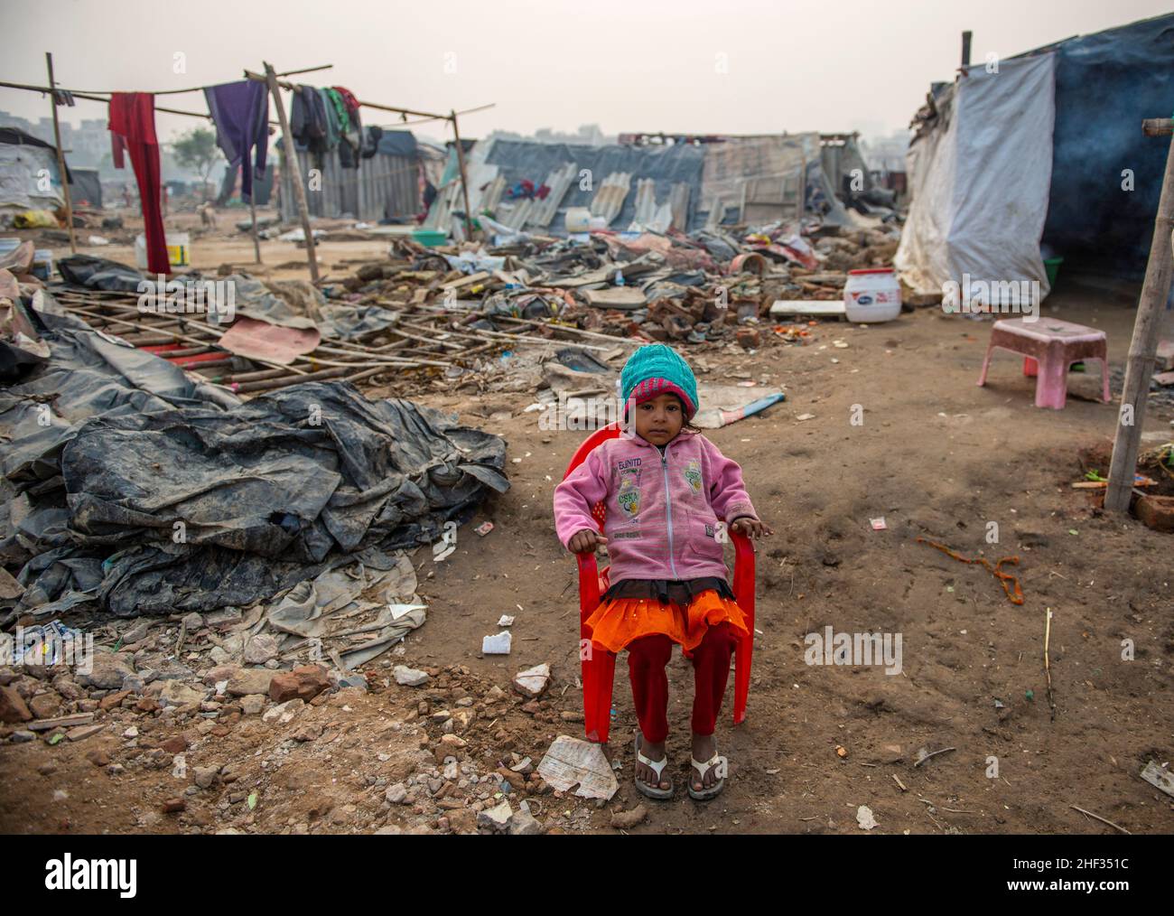 Ghaziabad, India. 13th Jan, 2022. A child is seen sitting on a small ...