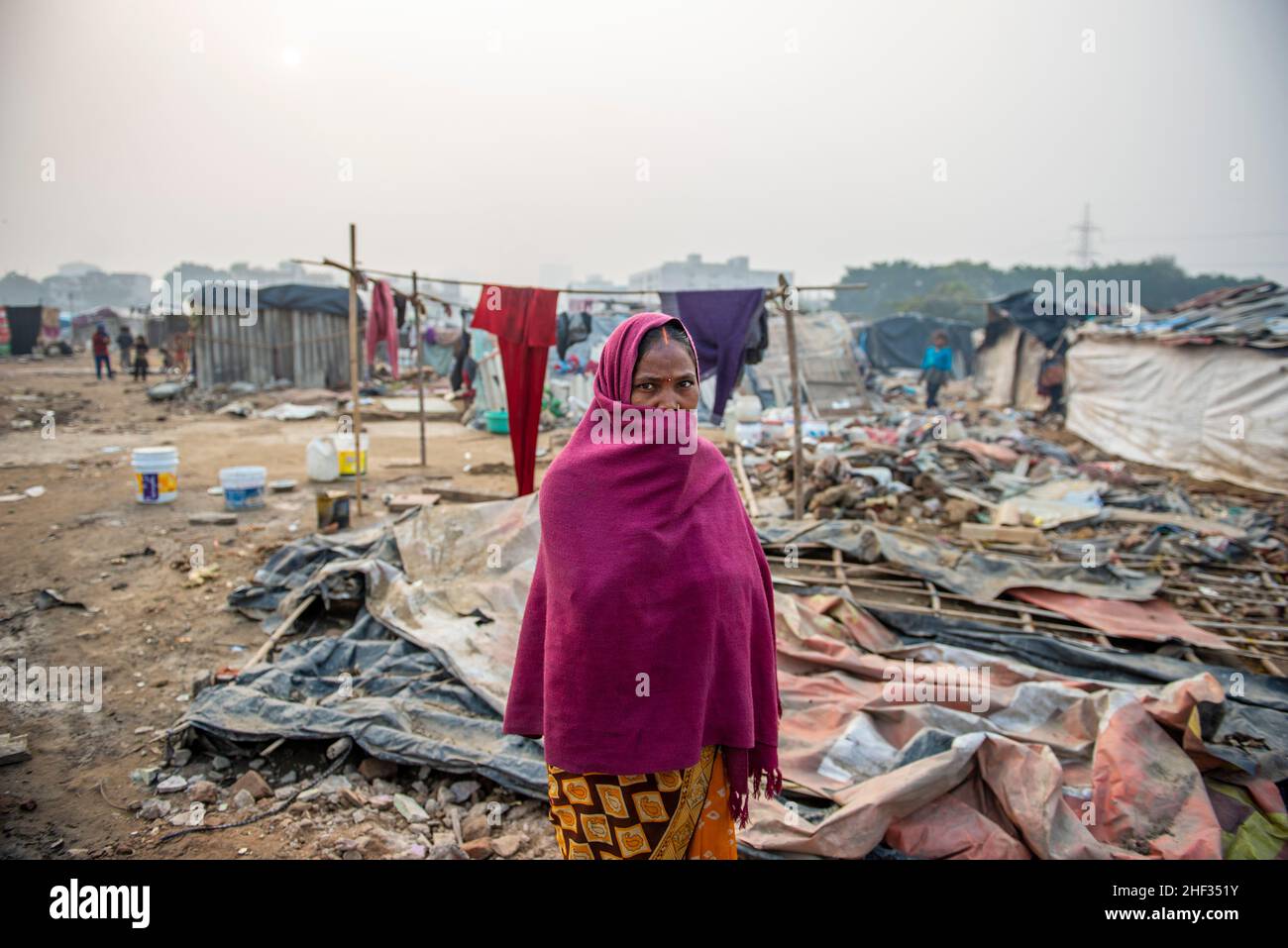 Ghaziabad, India. 13th Jan, 2022. A woman seen covering her face with ...