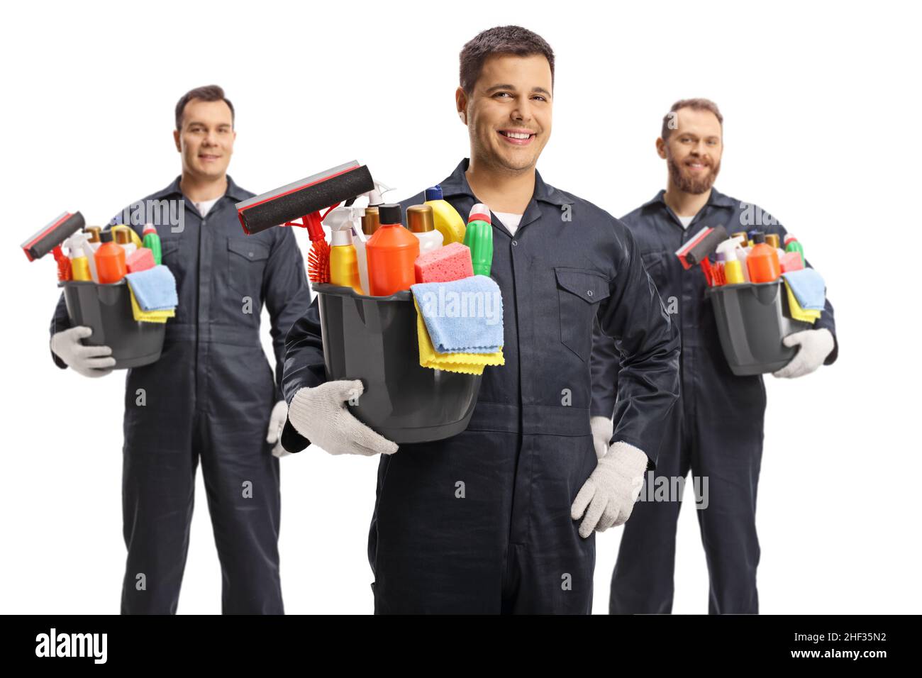 Professional male cleaners in usniform holding bucket with cleaning ...