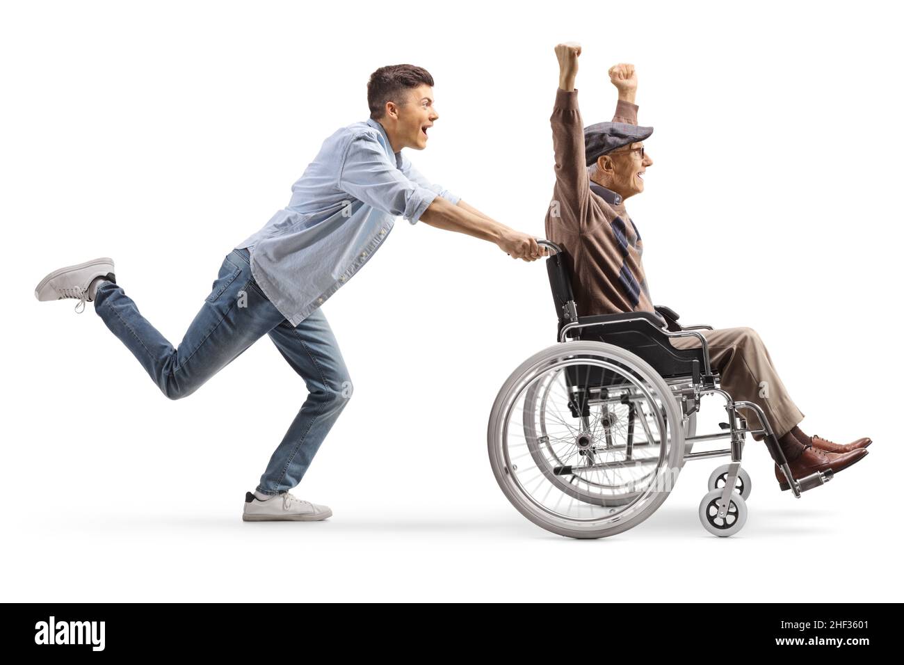 Full length profile shot of a young man running and pushing a happy ...