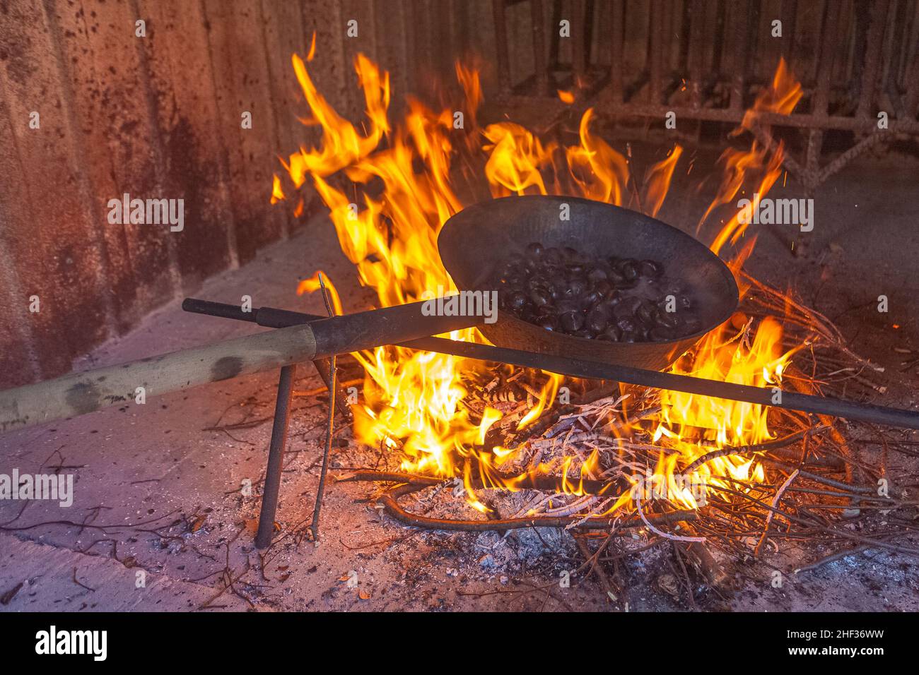 Chestnuts cooked on a pan over the fire Stock Photo - Alamy