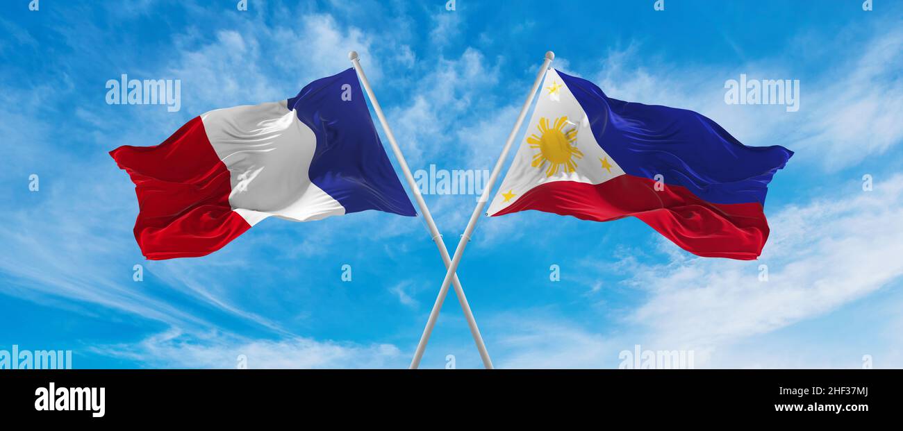 crossed national flags of France and Philippines flag waving in the ...