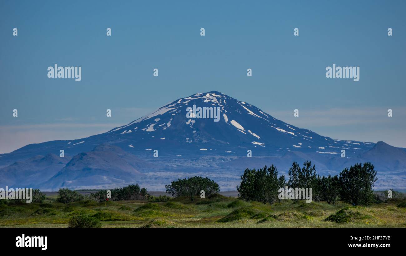 The infamous Hekla volcano towers above the landscape of South Iceland ...