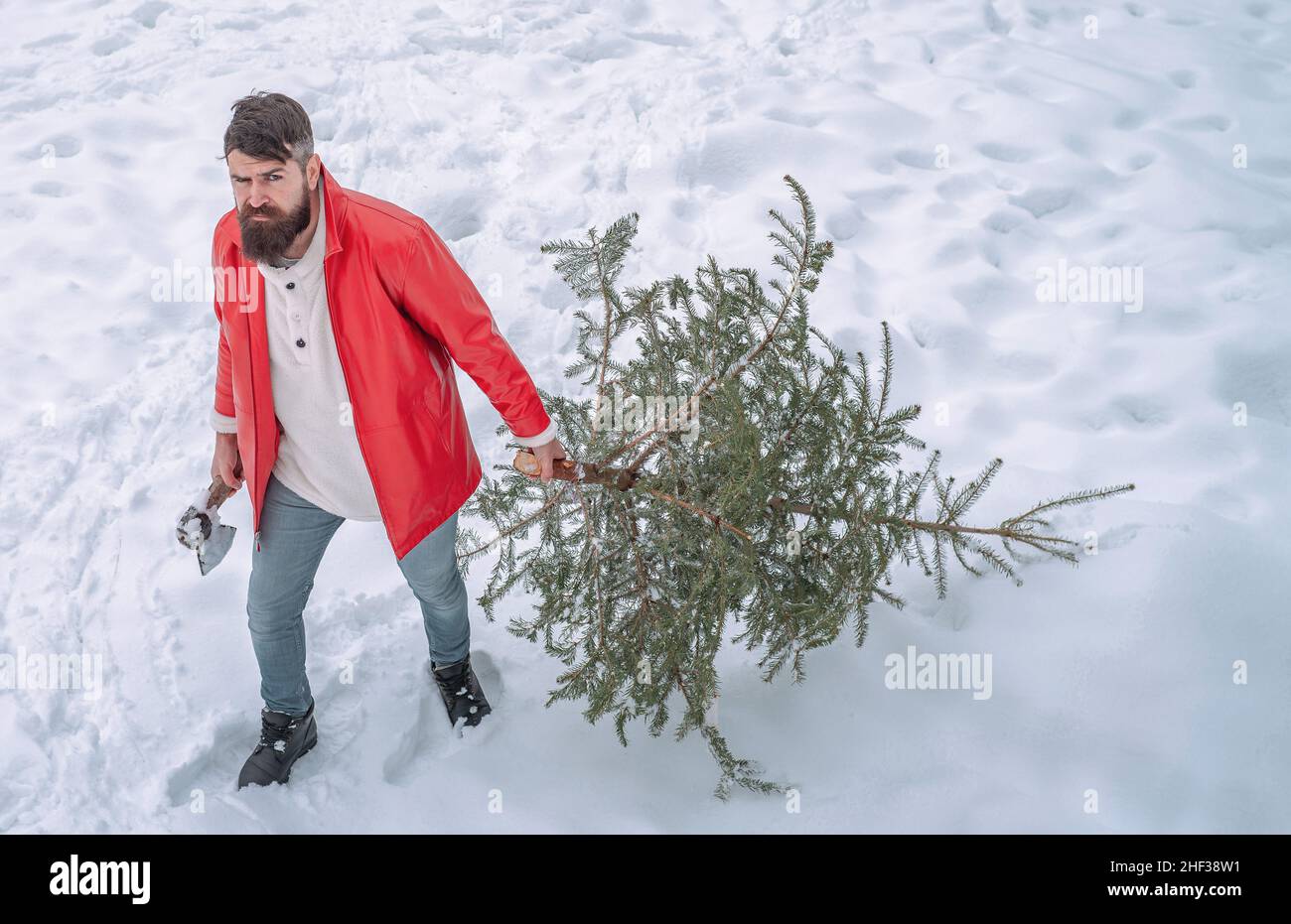 Santa in winter park. Lumberjack Santa standing with axe on forest ...