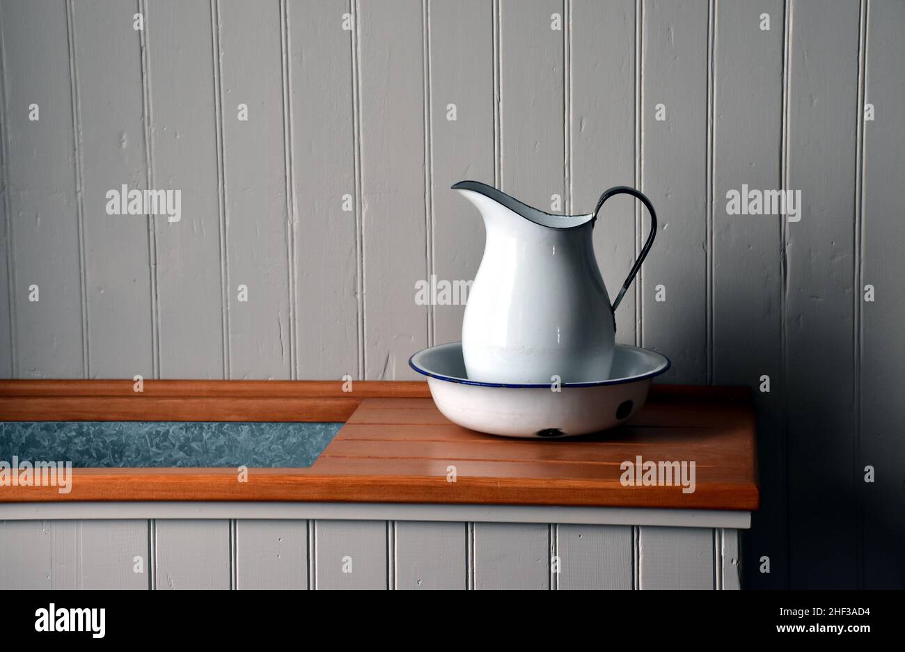 Old Fashion Enamel Pitcher and Pan on Wood Top Sideboard Stock Photo ...