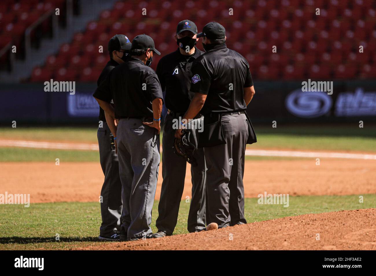MAZATLAN, MEXICO - FEBRUARY 02: ampayer, umpires , during the base run ...