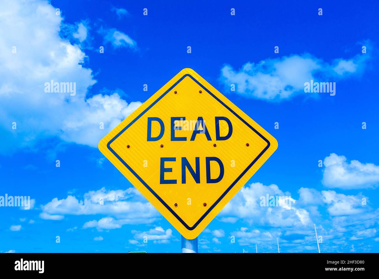 dead end street sign under blue sky with clouds Stock Photo - Alamy