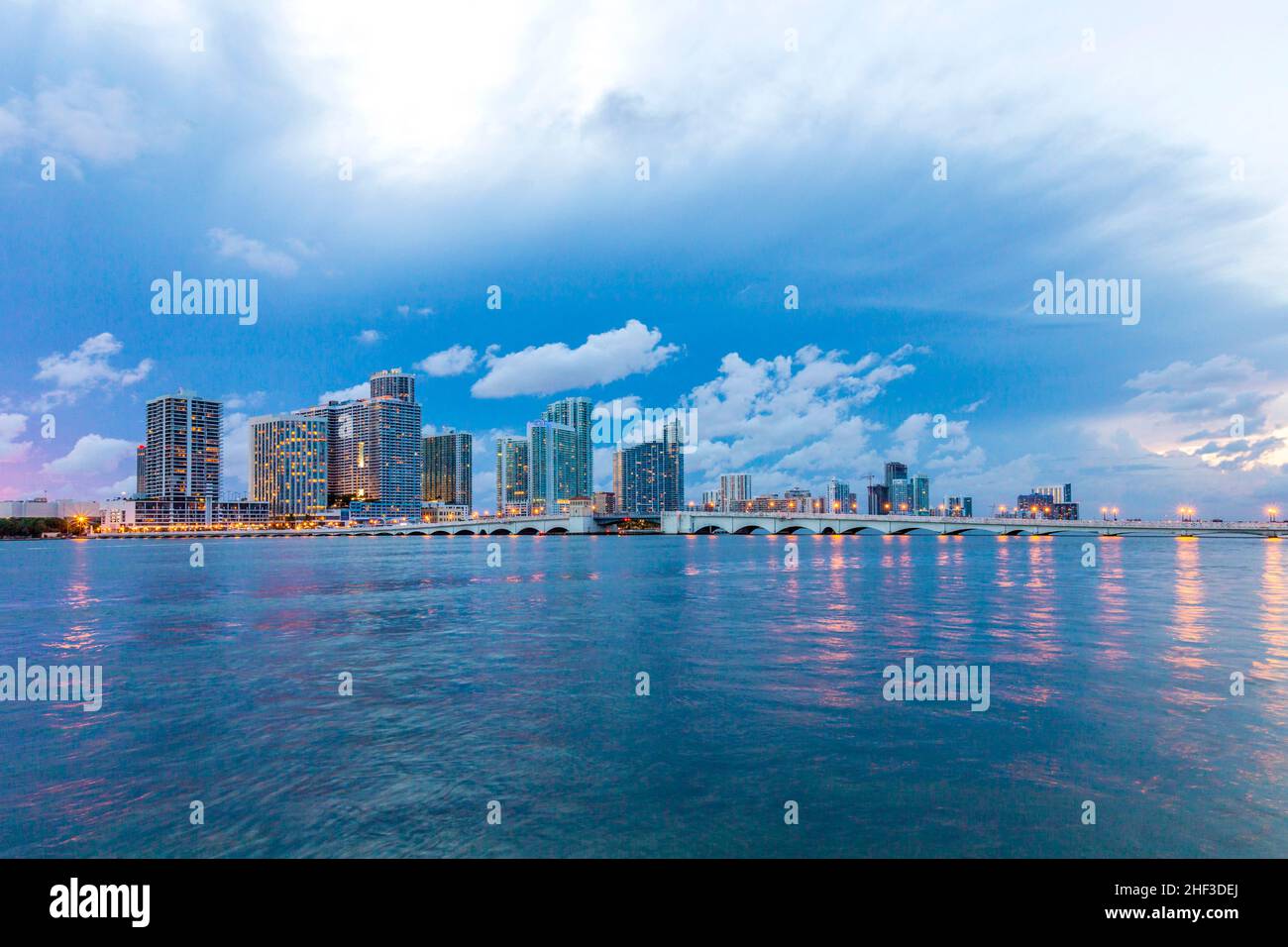 Miami city skyline panorama at dusk with urban skyscrapers and bridge ...