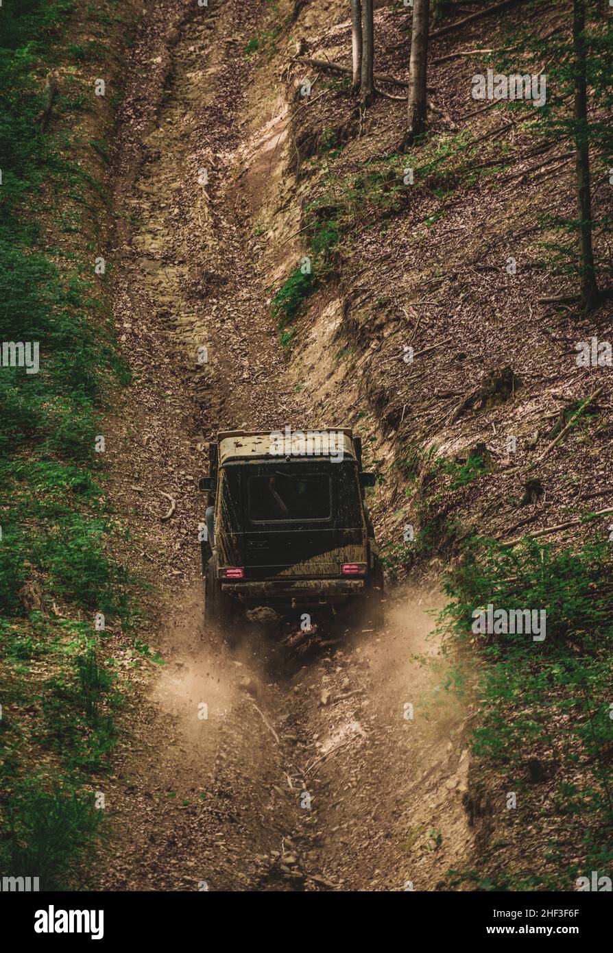 Motion the wheels tires and off-road that goes in the dust. Mud and ...