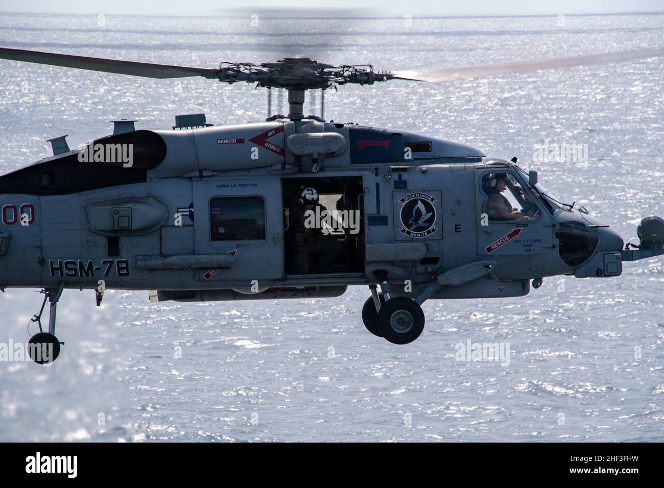 220111-N-MD461-1173 SOUTH CHINA SEA (Jan. 11, 2022) An MH-60R Sea Hawk ...