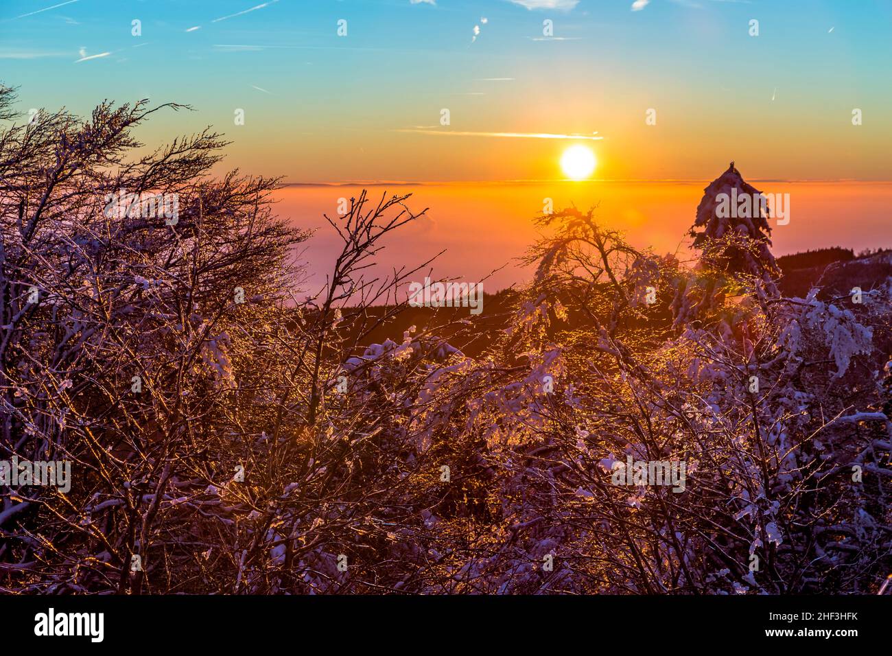 sunrise under the winter calm mountain landscape with beautiful fir ...