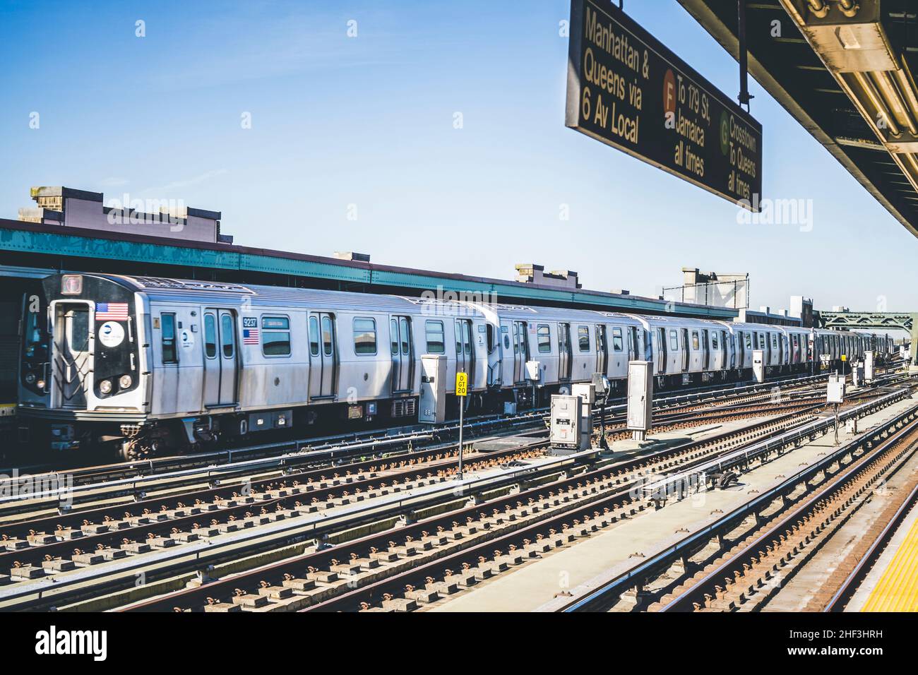 F subway train approaching elevated station in Brooklyn, New York ...