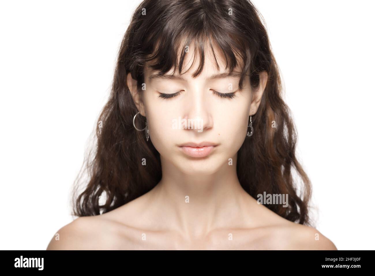 Beautiful young girl studio portrait. Eyes closed Stock Photo - Alamy