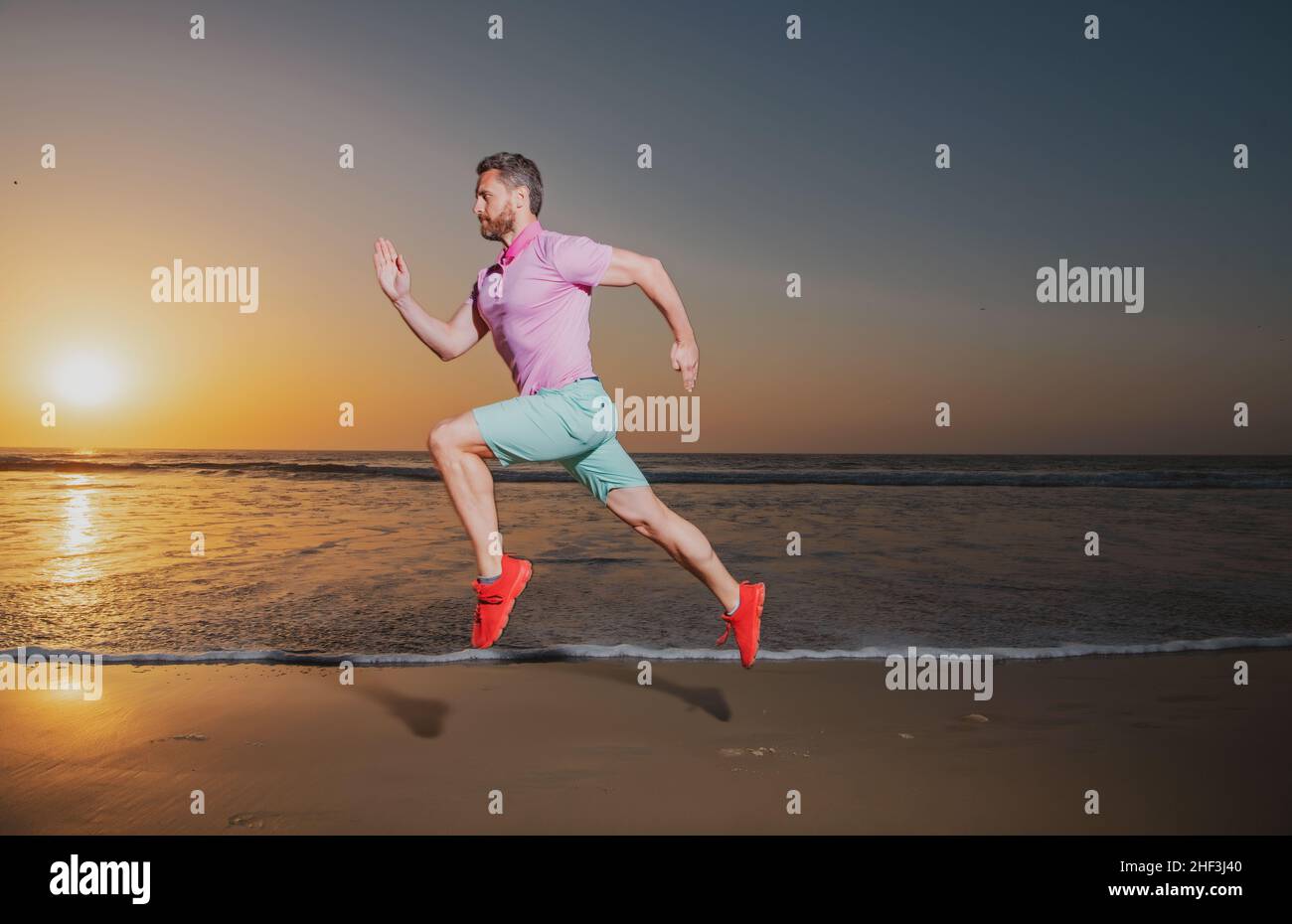 Man running on the beach at sunset. Sport and healthy lifestyle ...