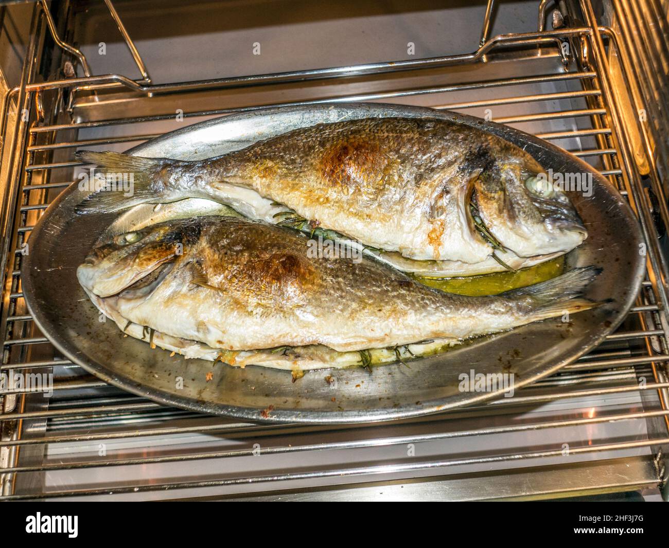Fish at oven hi-res stock photography and images - Alamy