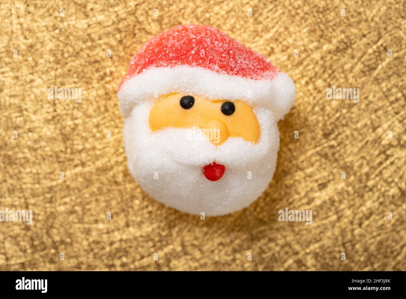 Santa Claus candy on gold background Stock Photo - Alamy