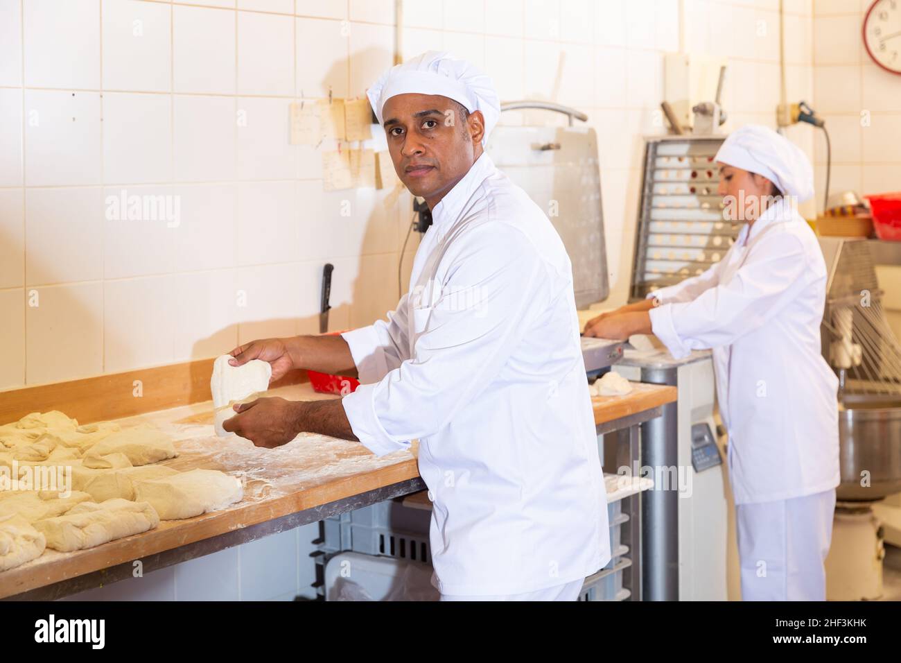 Latino bakery chef preparing dough in bakery Stock Photo - Alamy