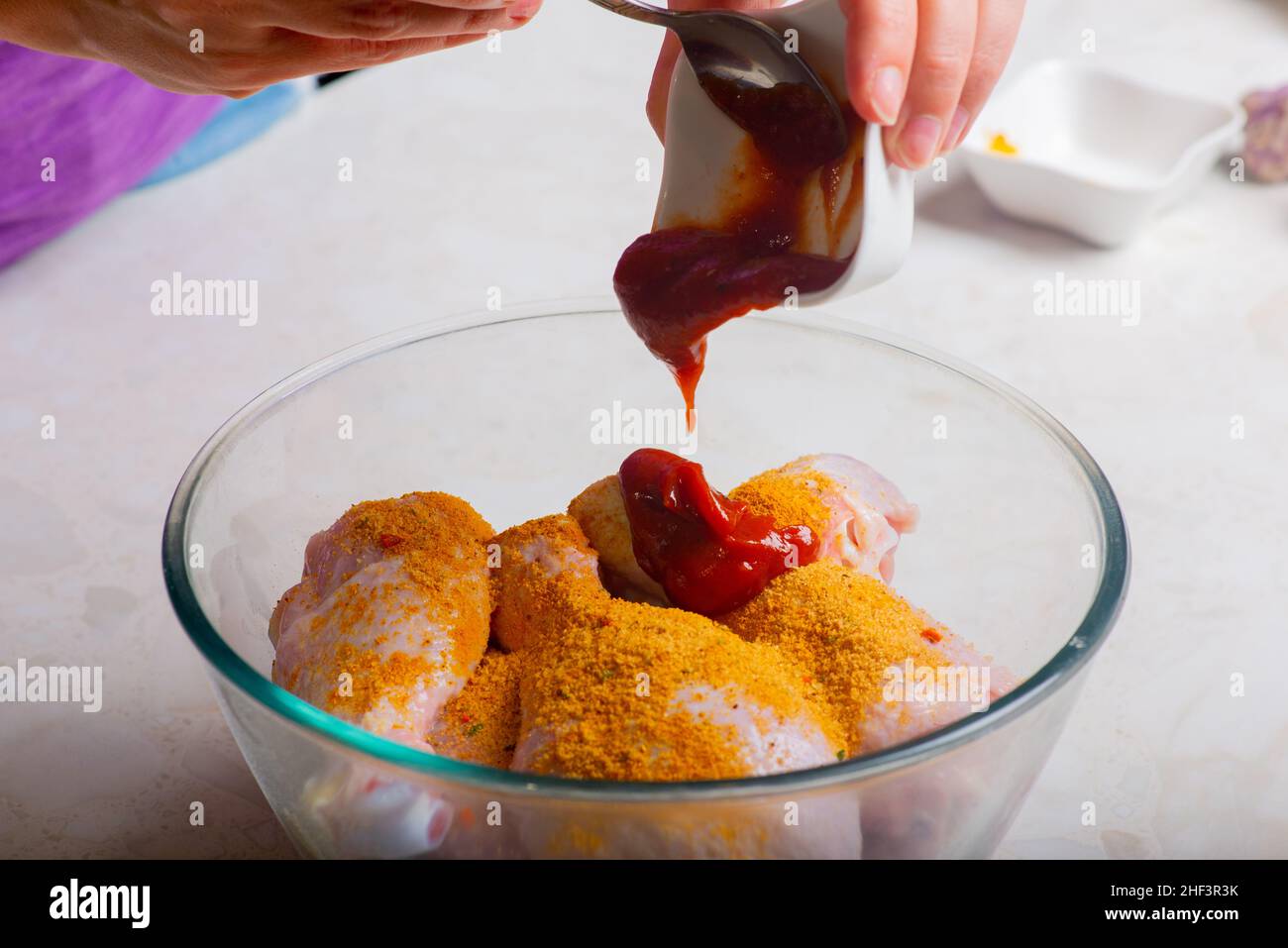chicken legs in a cup sprinkled with tomato paste Stock Photo - Alamy
