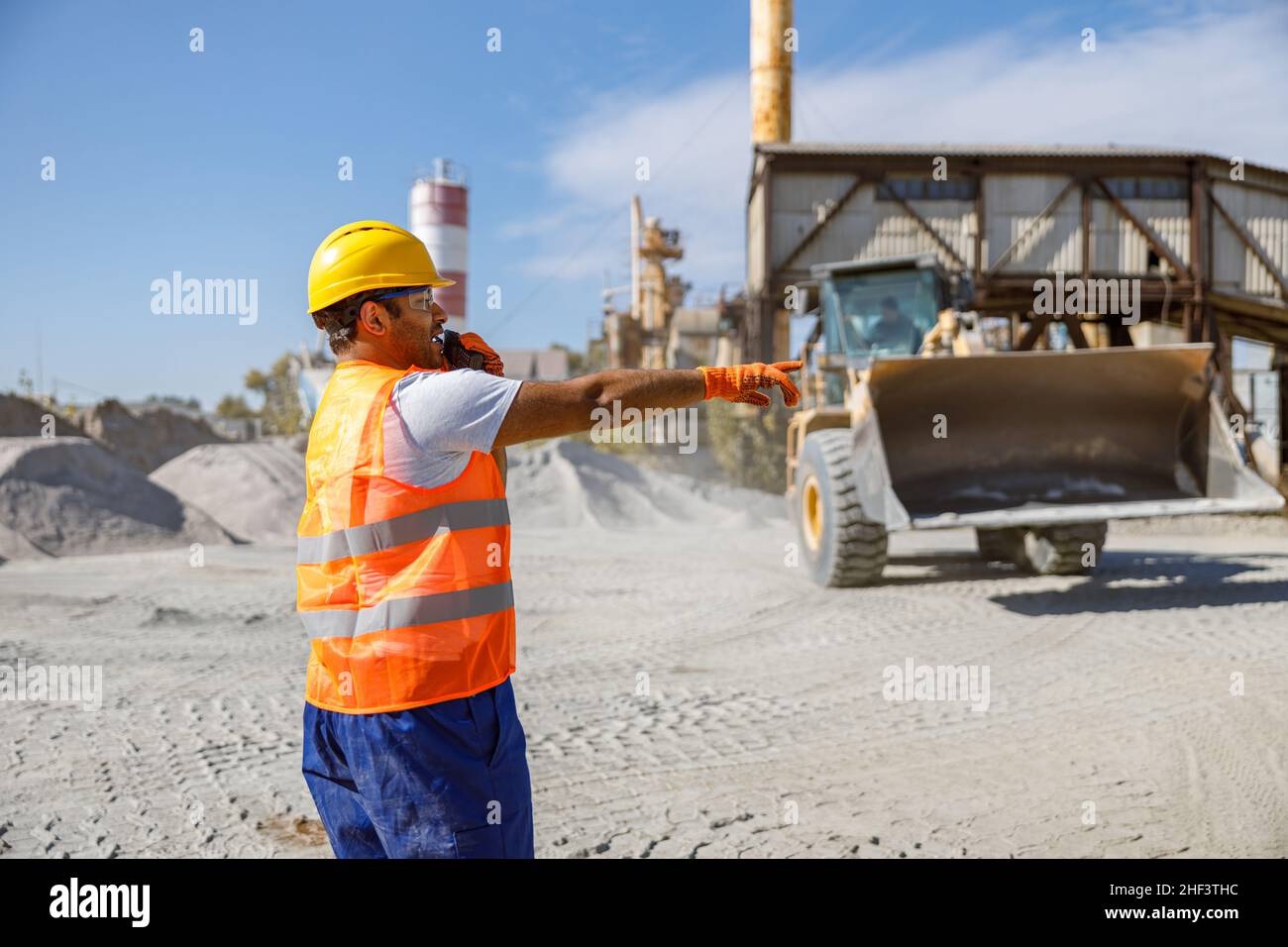 Photo of man working hard at construction industry plant Stock Photo ...