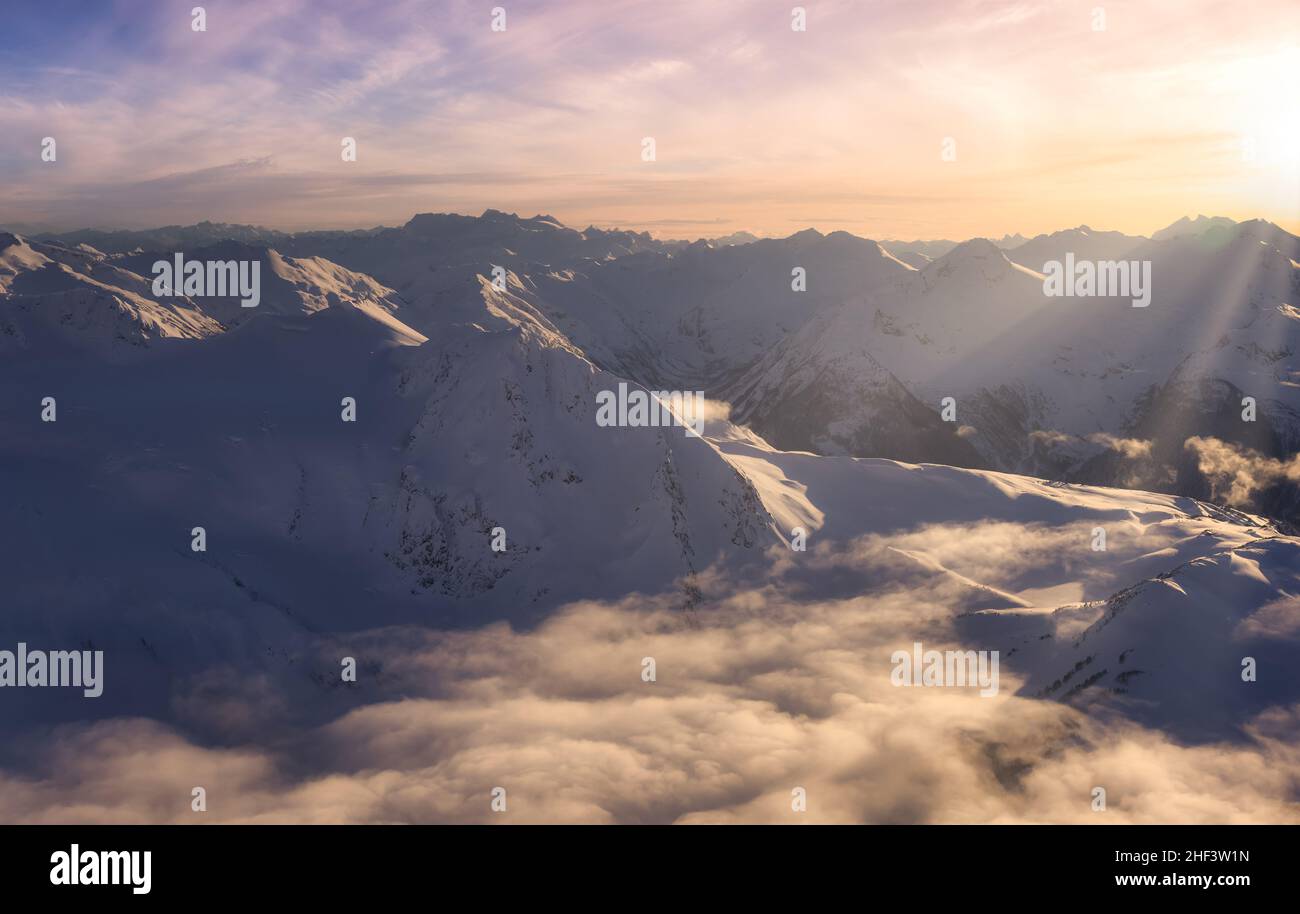 Aerial View of Canadian Mountain covered in snow Stock Photo - Alamy