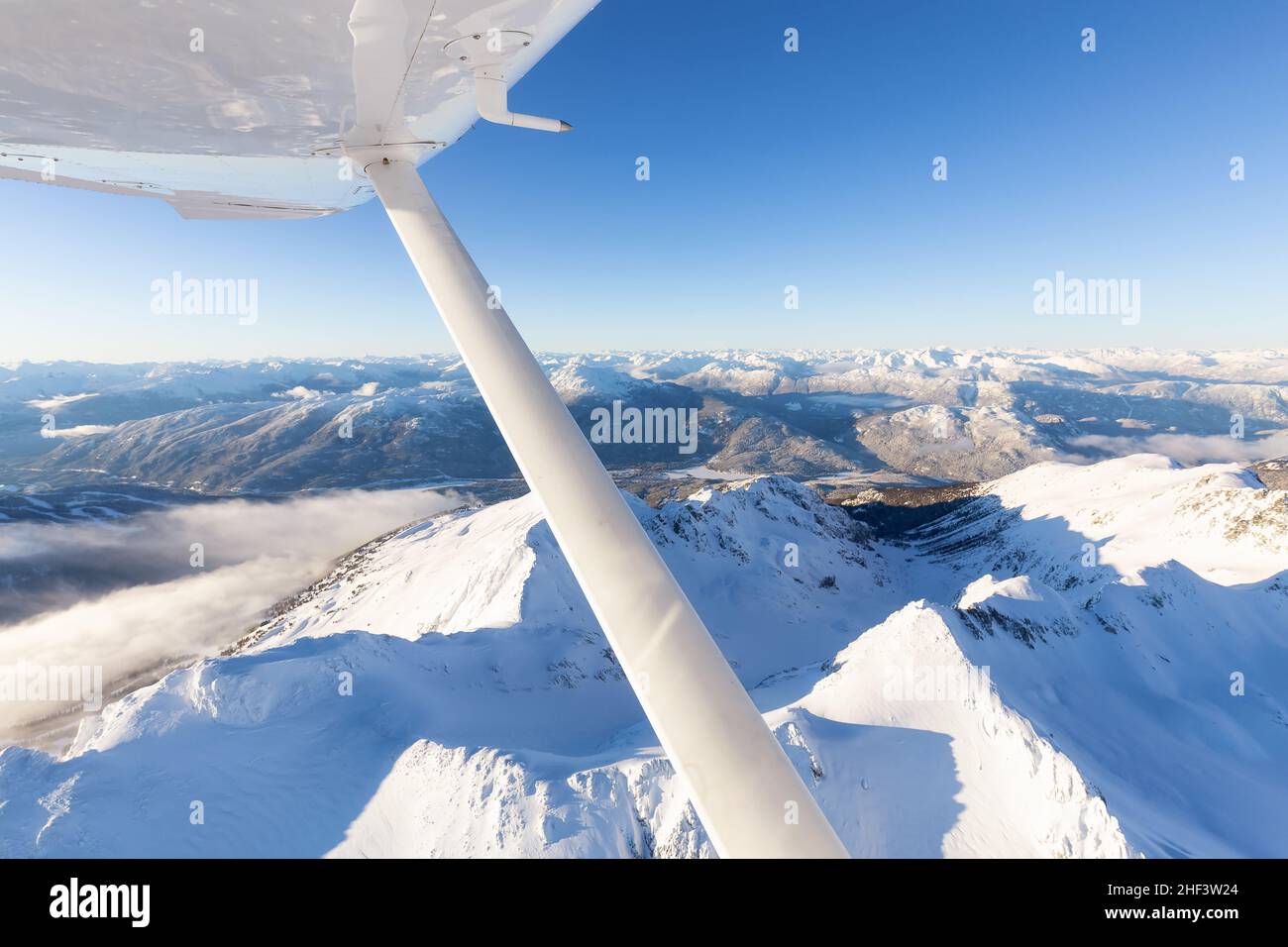 Aerial View flying from a small airplane over the mountain landscape ...