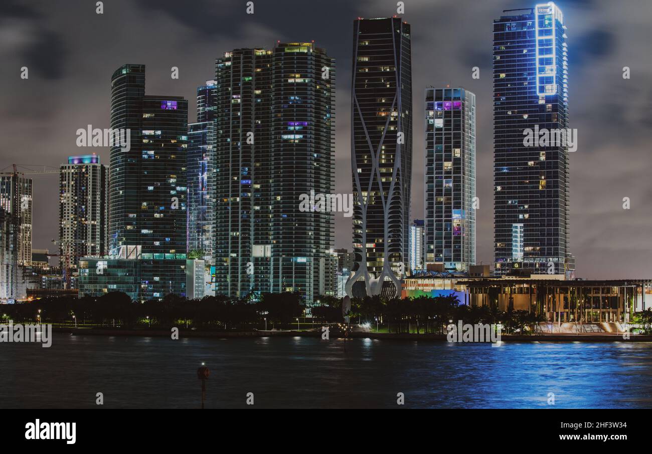 Miami Florida at sunset, skyline of illuminated buildings and Macarthur ...