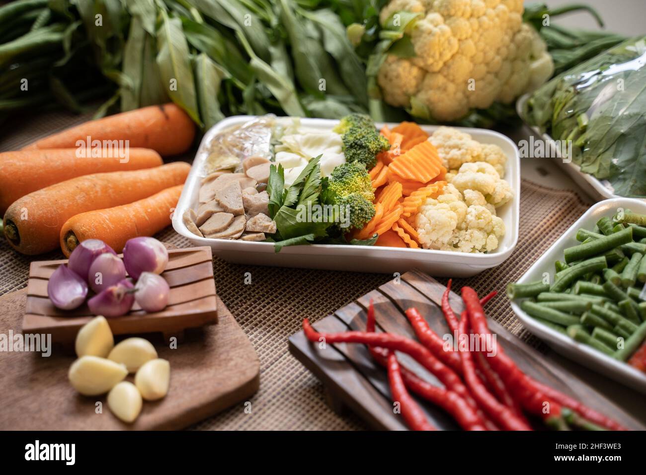 Assorted fresh vegetables to make soup wrapped in packaging Stock Photo ...