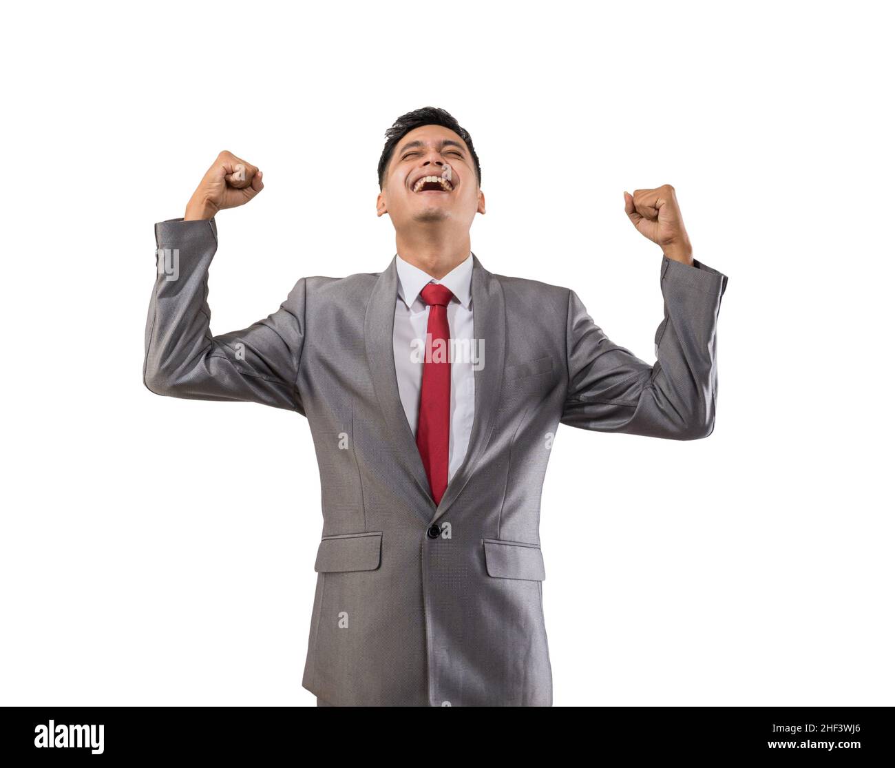 excited young businessman raise his hand isolated over white Stock ...