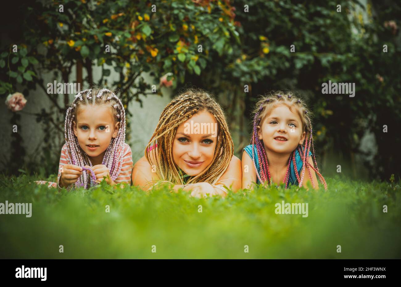 Family outdoor leisure. Mother and children at backyard. Picnic. Happy ...