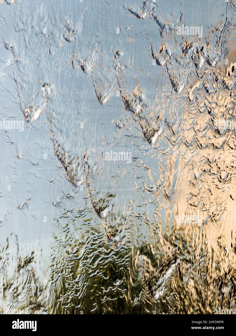 beautiful pattern of flowing water at a metal wall Stock Photo - Alamy