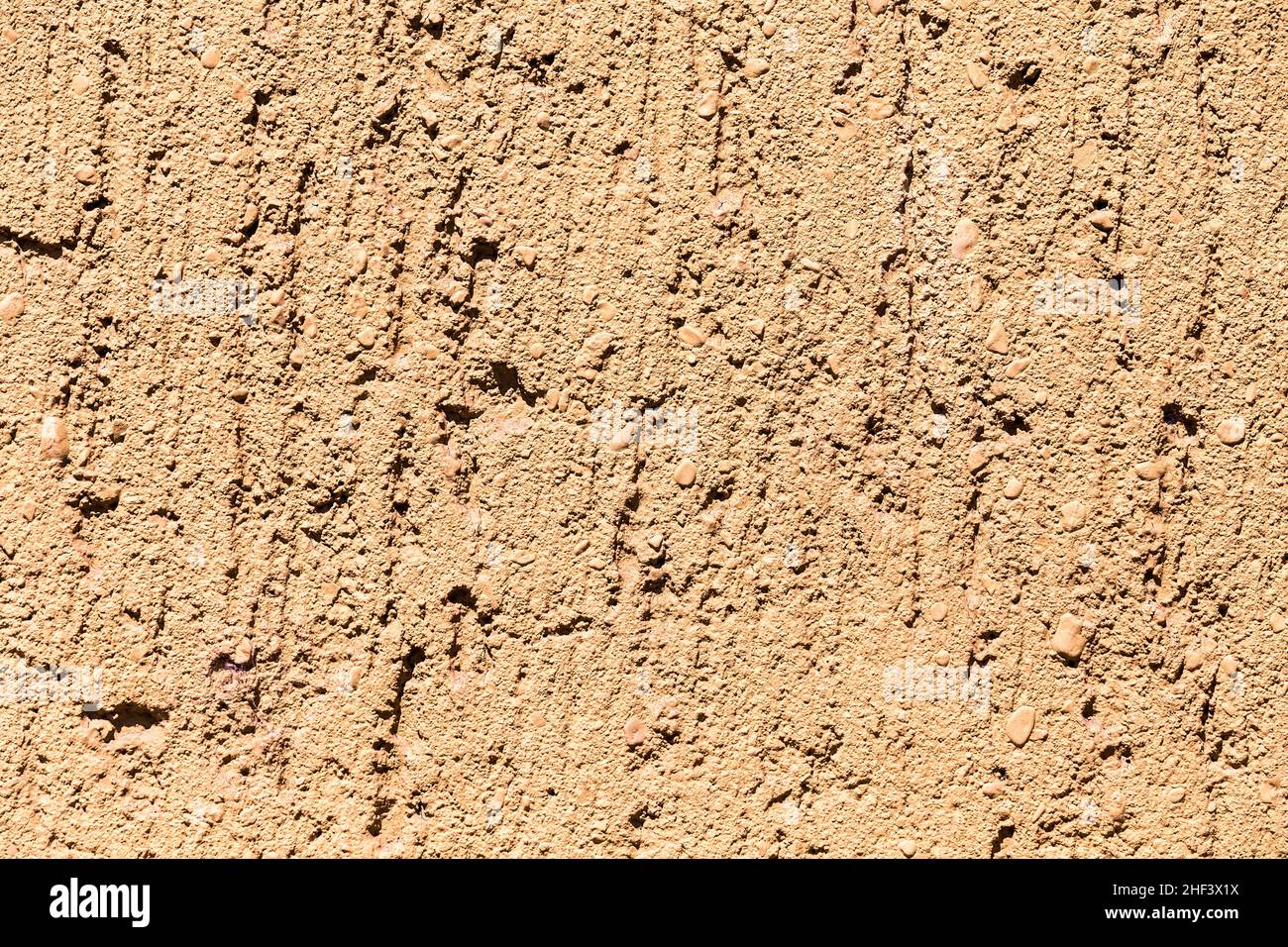 Texture of ocher harmonic concrete wall Stock Photo - Alamy