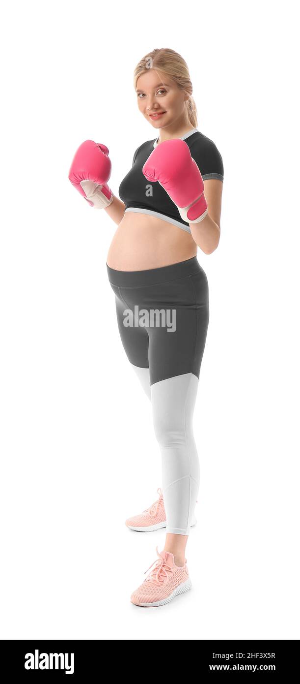 Young pregnant woman in boxing gloves on white background Stock Photo ...