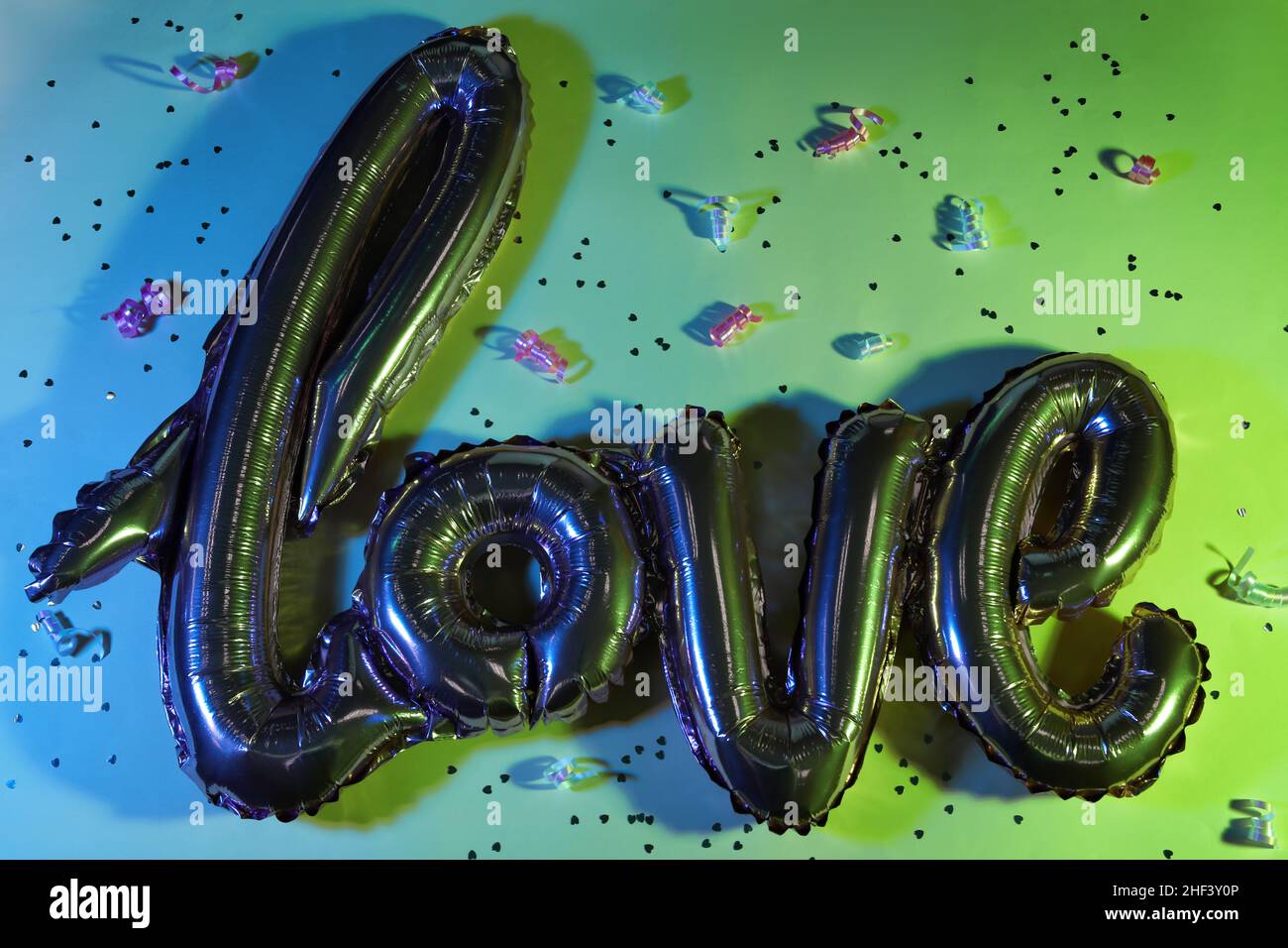 Composition with balloon in shape of word LOVE on color background ...