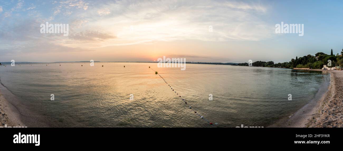 evening at the beach in Marseilles, France with view to the oil ...