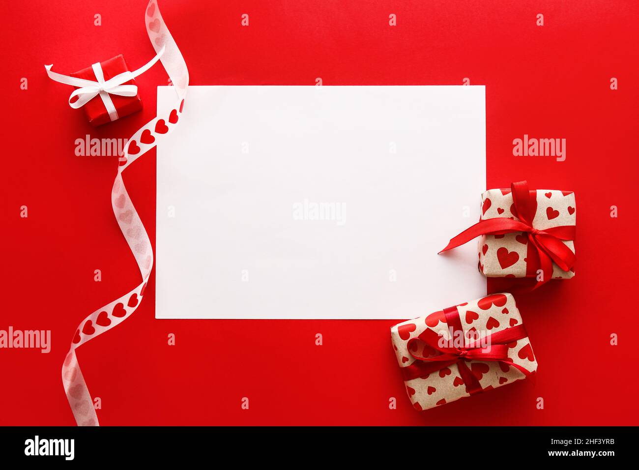 Blank card with gifts for Valentine's Day on red background Stock Photo ...