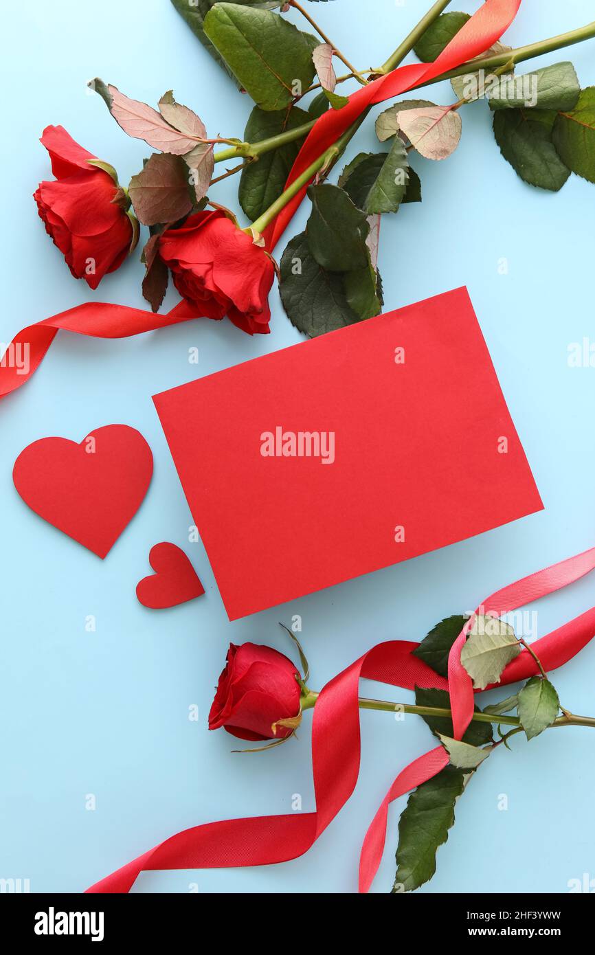 Composition with blank card, rose flowers and ribbons on color ...