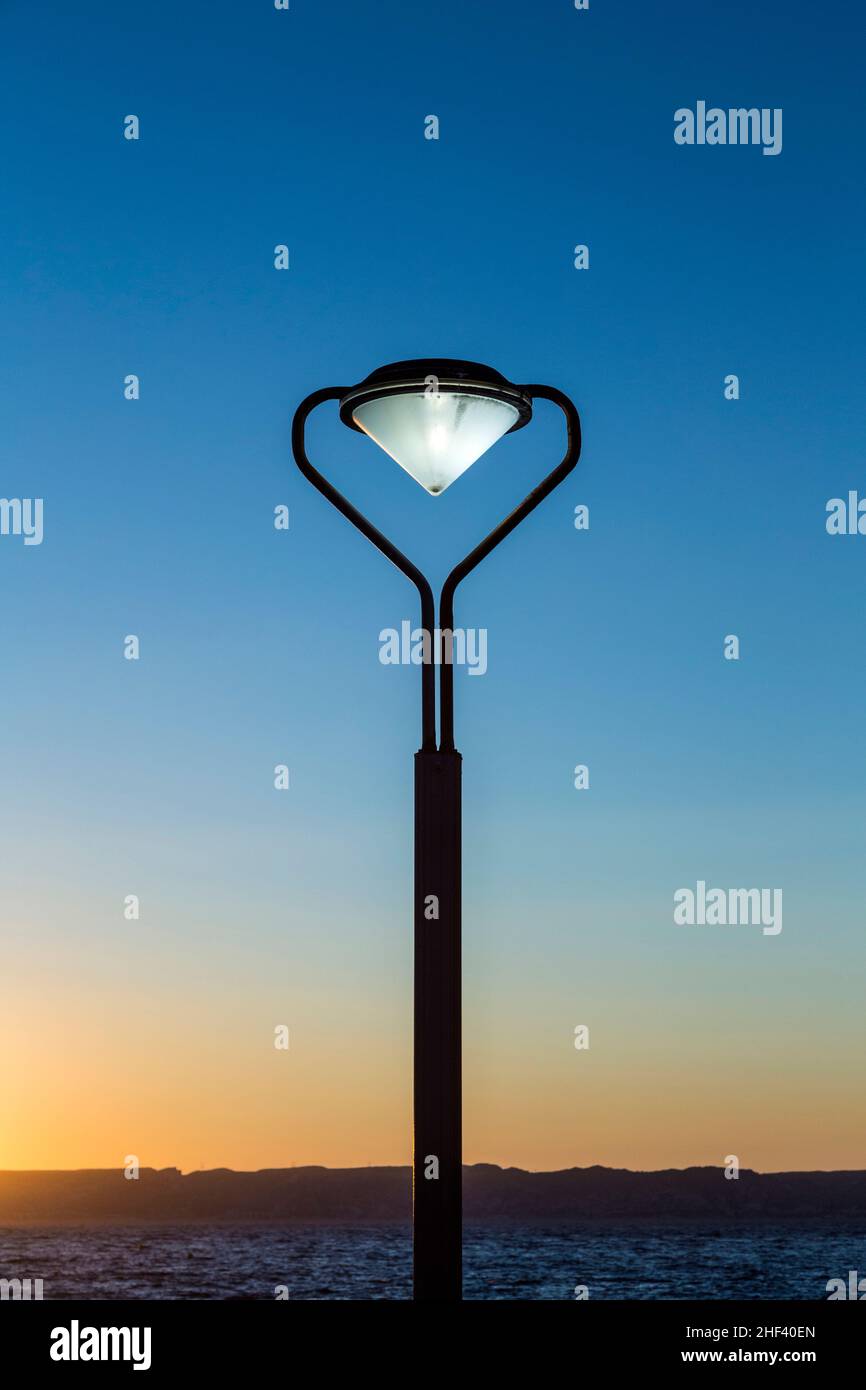 lantern with burning light at sunset at the Corniche, Marseille Stock ...