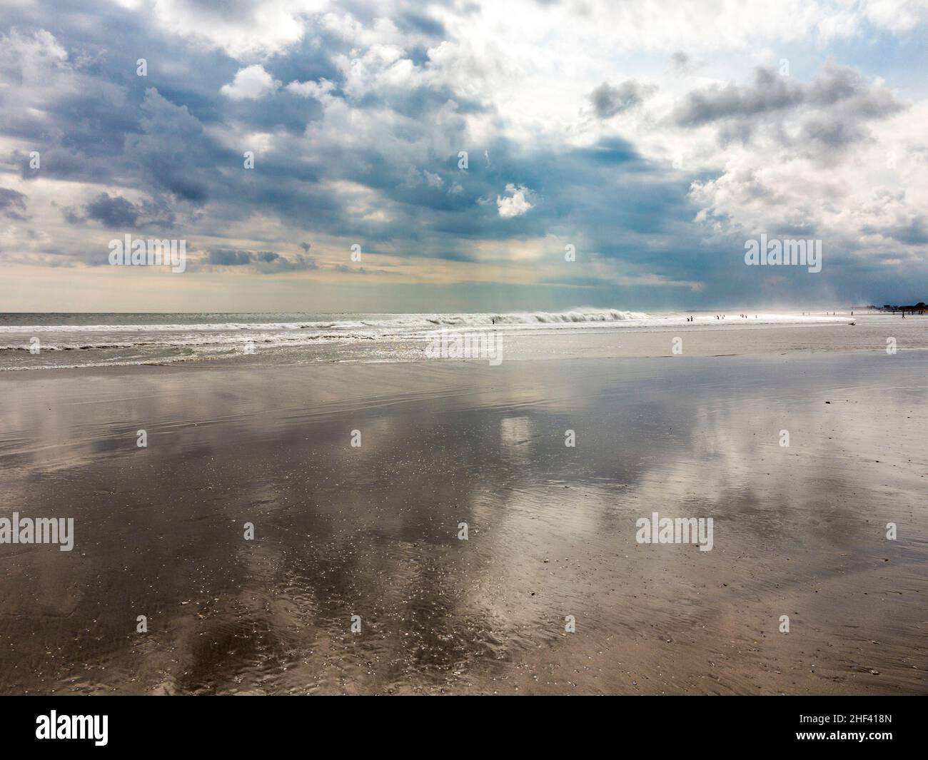 scenic beach with waves in Kuta, Bali with reflection at the beach ...