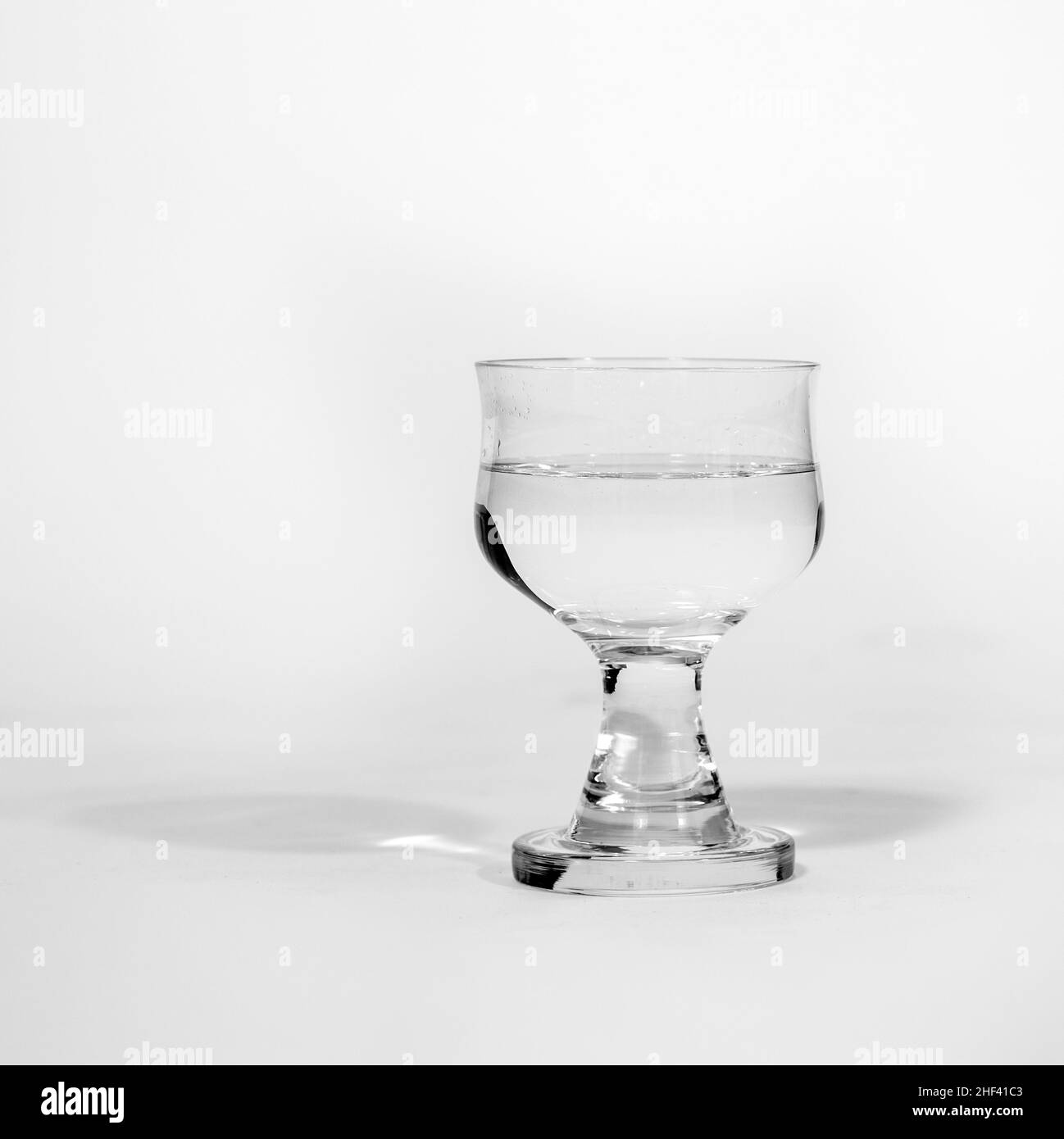 simple glass isolated on white with water Stock Photo - Alamy