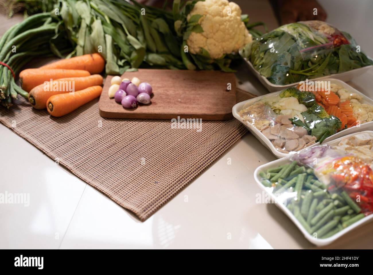 Fresh vegetables and wrapped in disposable polyethylene polymer ...
