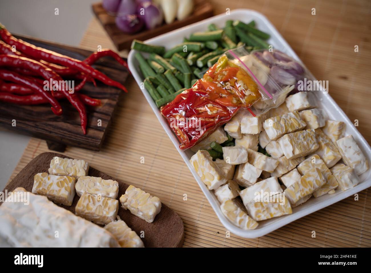 Tempeh and stir-fried spices wrapped in polyethylene polymer packaging ...