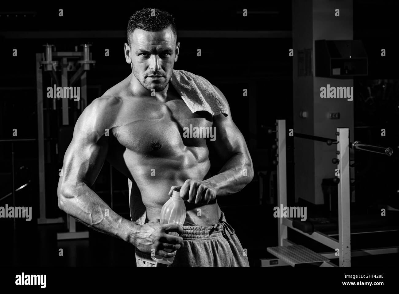 Stay hydrated concept. Weightlifter gym man preparing for training ...