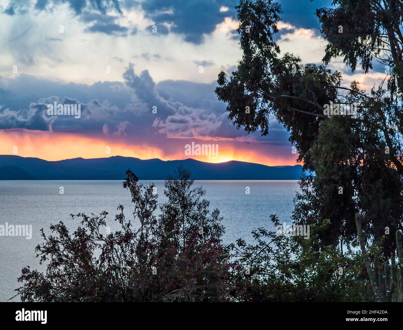 sunset over lake titicaca in village of Copacabana Stock Photo - Alamy