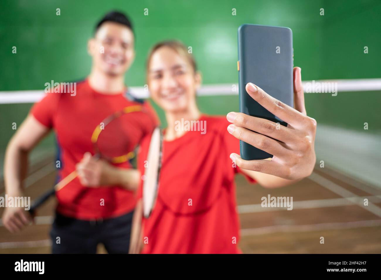 Two badminton players take a selfie with a smartphone camera Stock ...