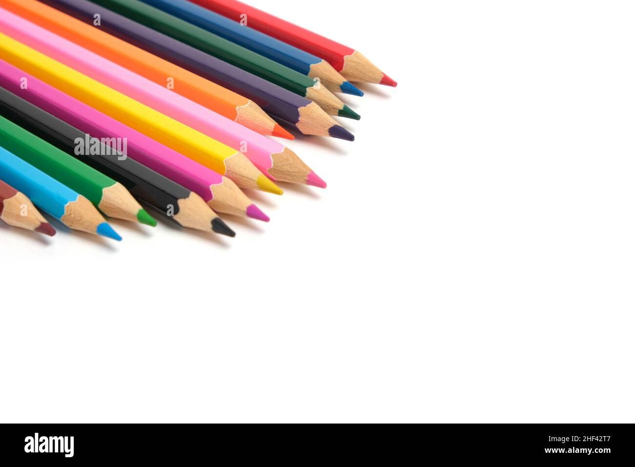 Bright colored pencils on a white background.School supplies for ...